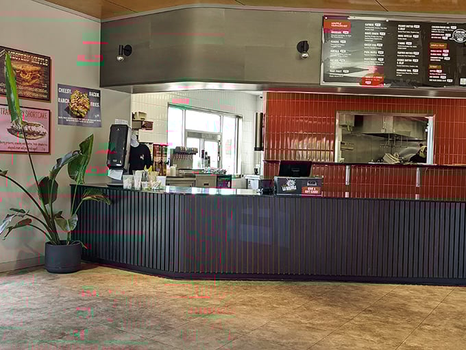 The ordering counter beckons with possibilities. That red tile backsplash adds just the right pop of color to frame your waffle dreams.