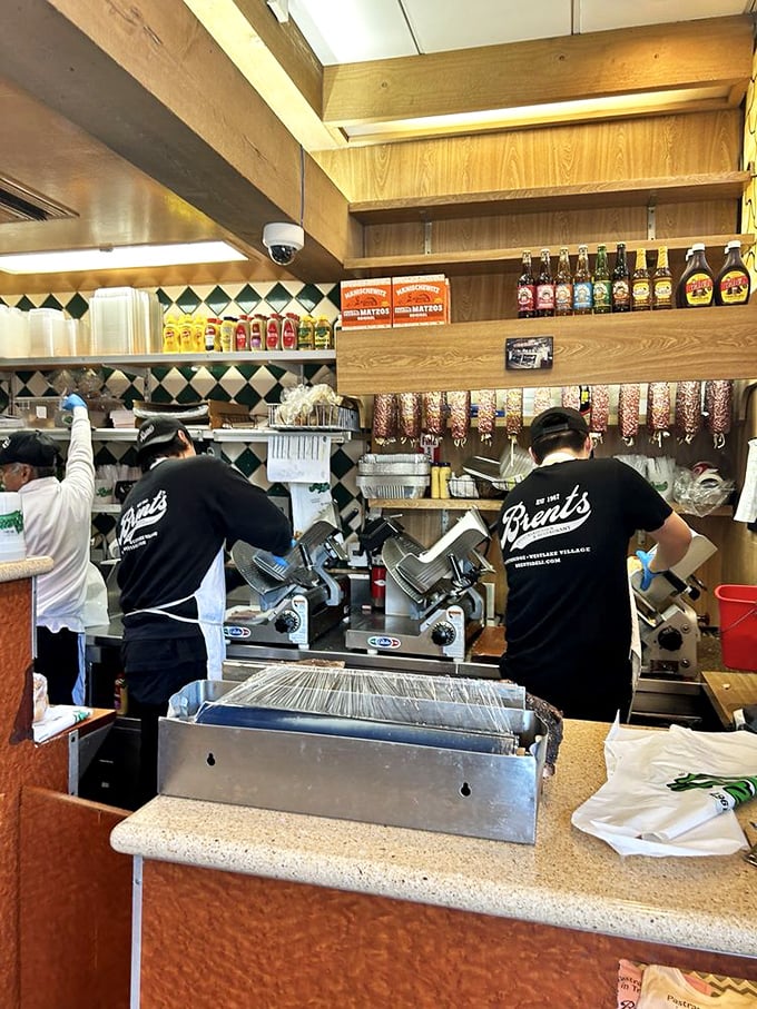 The masters at work, slicing with the precision of surgeons. There's an art to proper deli meat preparation that takes years to perfect.