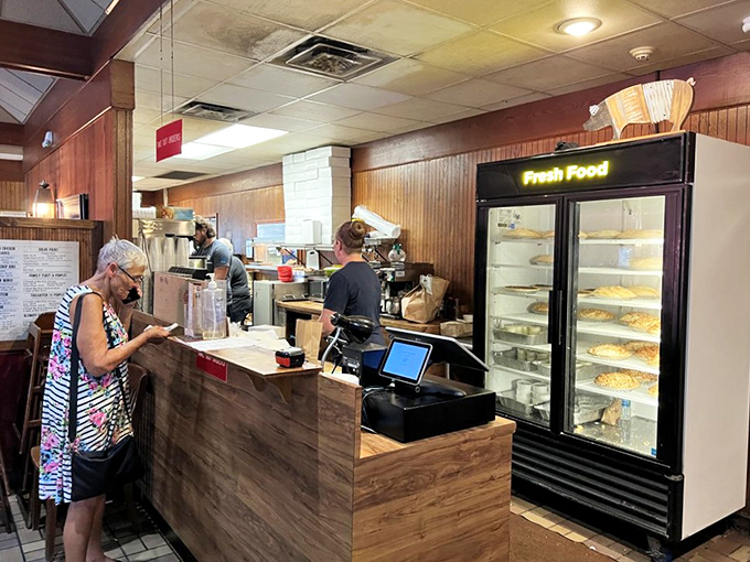 Where the magic happens&mdash;the counter where barbecue dreams come true. Those pies in the display case aren't just desserts; they're sweet finales.