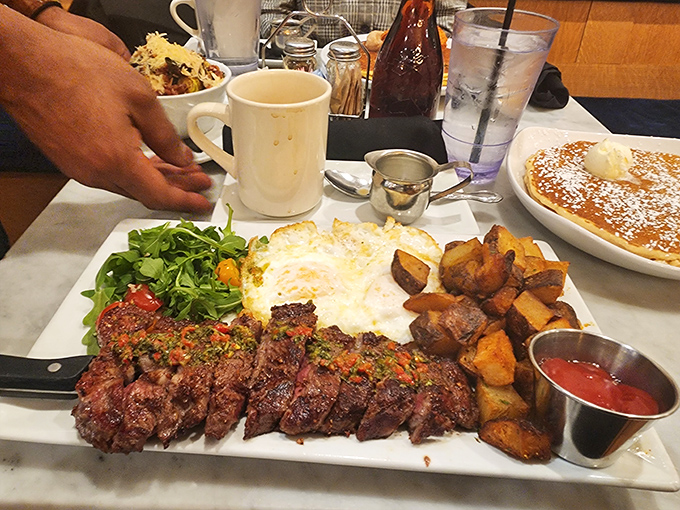 This steak and eggs plate doesn't just break the fast – it demolishes it with carnivorous enthusiasm and perfectly roasted potatoes.