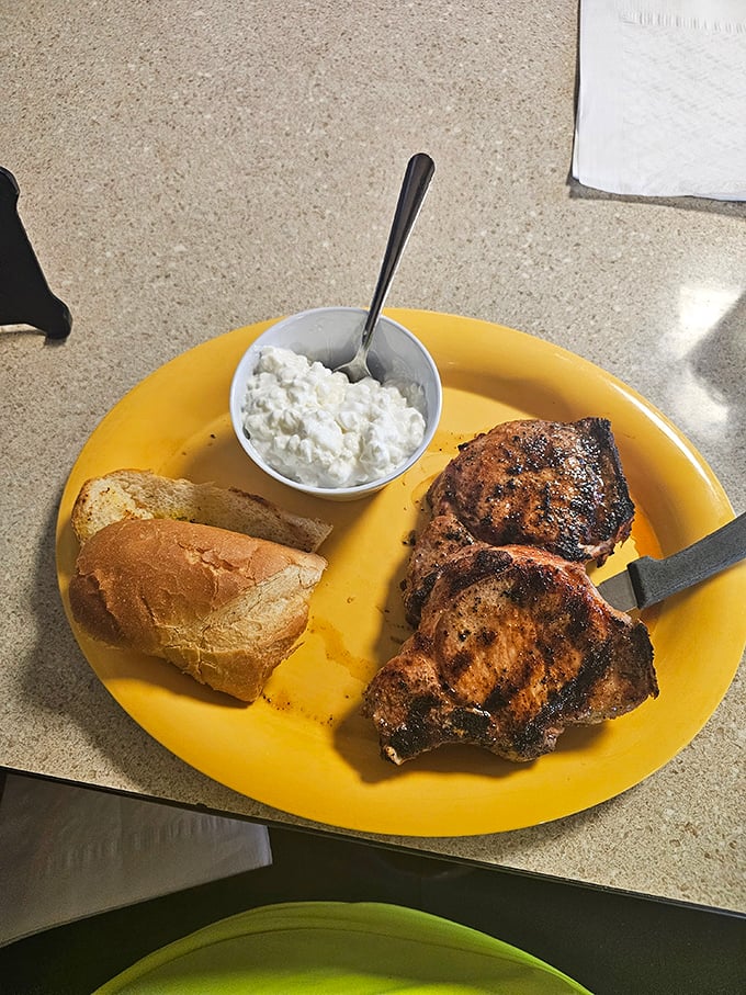 The Apple Barrel Restaurant's distinctive facade promises homestyle cooking with a side of Nebraska charm. The fried chicken sign is no idle boast.