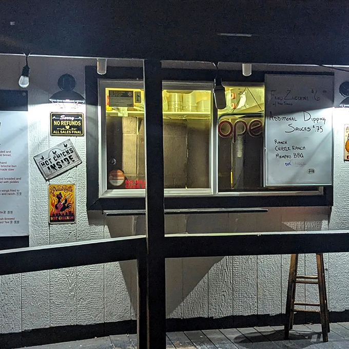 Even at night, Pyre's ordering window glows like a beacon for those seeking Nashville-style satisfaction. The "Hot Chicken Inside" sign doesn't lie. 