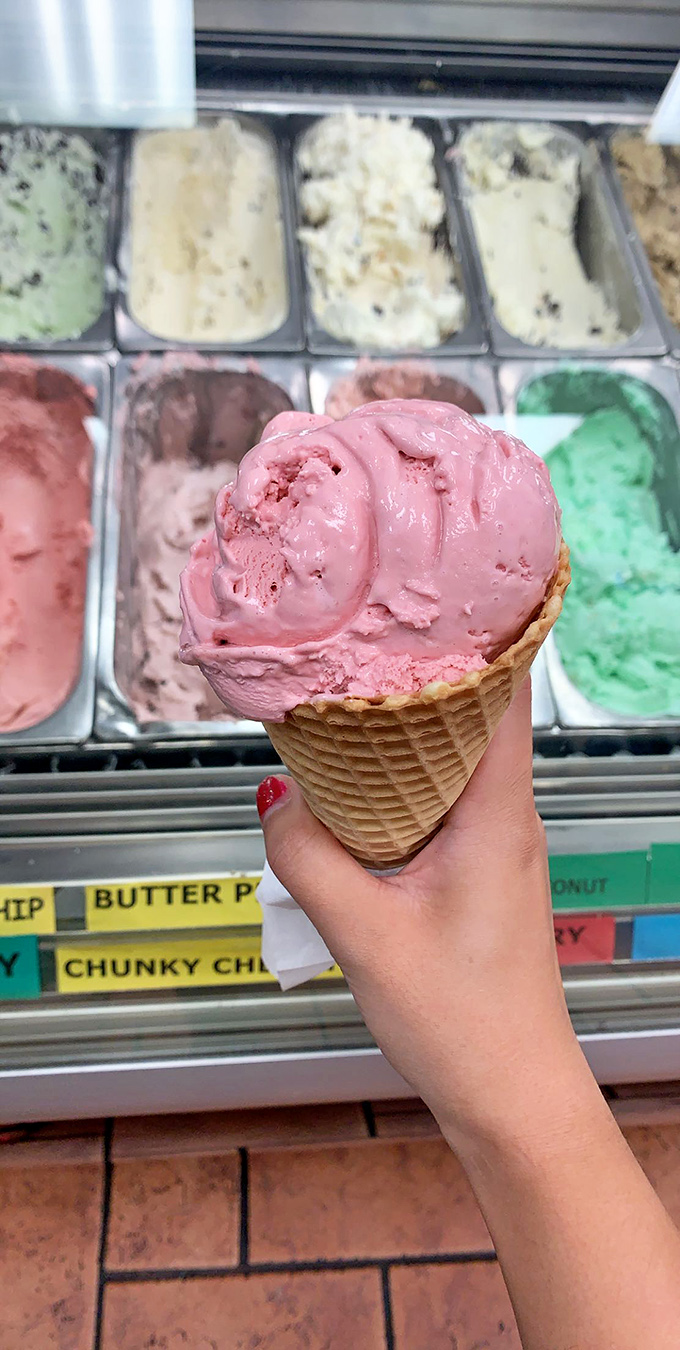 That strawberry scoop isn't just pink&mdash;it's the exact color of summer optimism. The waffle cone provides the perfect crunchy counterpoint.