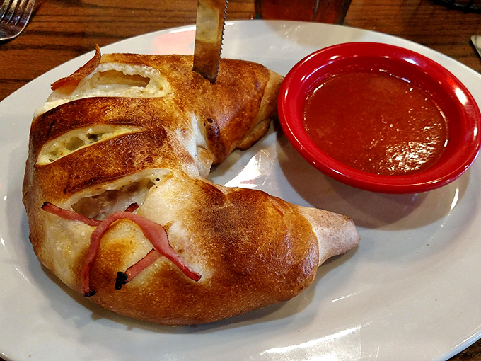 This stromboli has that golden-brown glow that says, "I'm stuffed with good things and not sorry about it."