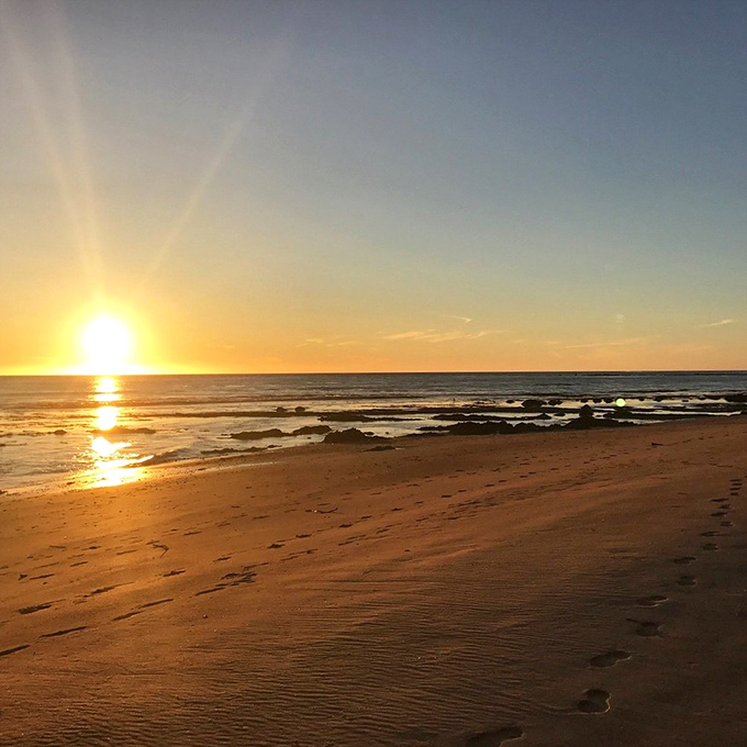 The golden hour transforms an already magical beach into pure California fantasy. Sunsets here make even non-believers consider the divine.