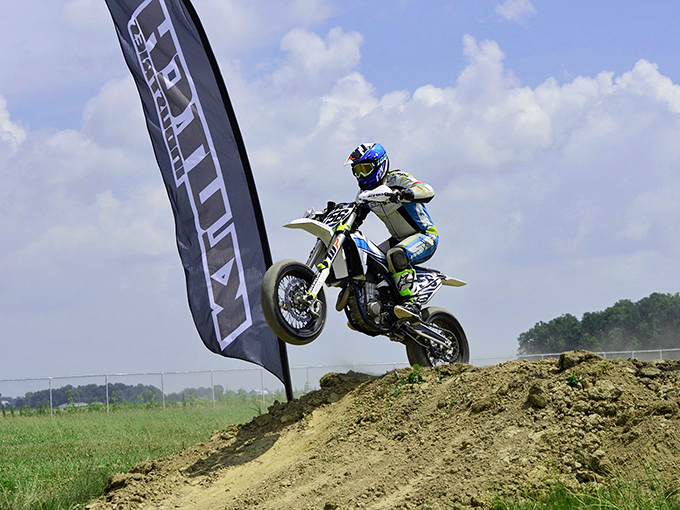 The dirt jump section adds an airborne dimension to Supermoto events, where gravity becomes merely a gentle suggestion rather than a law.