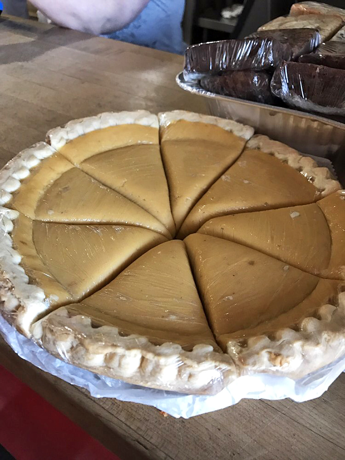 Sweet potato pie, sliced and ready for its close-up. The Southern dessert that whispers "you still have room for me."