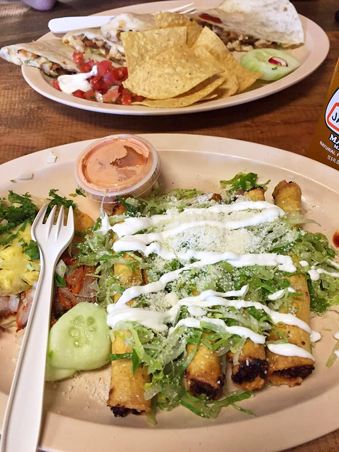 These taquitos aren't just rolled and fried &ndash; they're architectural masterpieces of crunch, crowned with a zigzag of crema that means business.