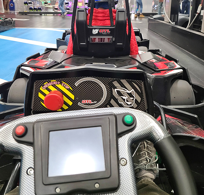 The cockpit view reveals what racers see&mdash;buttons, displays, and the overwhelming urge to make "vroom vroom" noises despite the electric motor. 