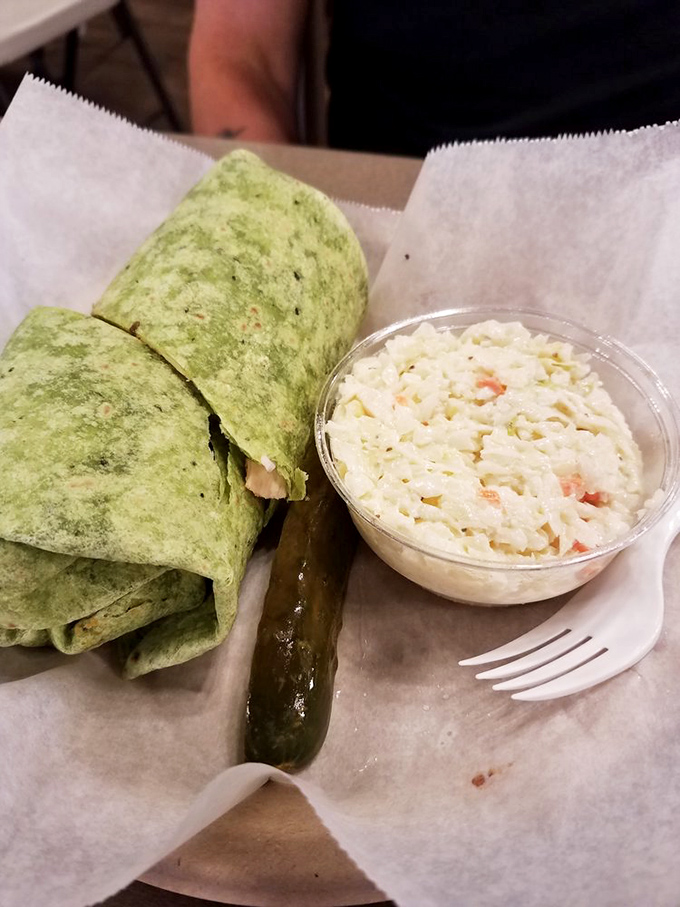 A wrap that makes you forget bread exists. Paired with coleslaw that didn't come from a plastic tub &ndash; revolutionary concept.