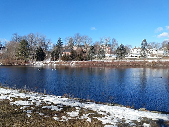 Winter's light dusting of snow along the riverbank creates that quintessential New England scene that makes even cold-weather skeptics reconsider.