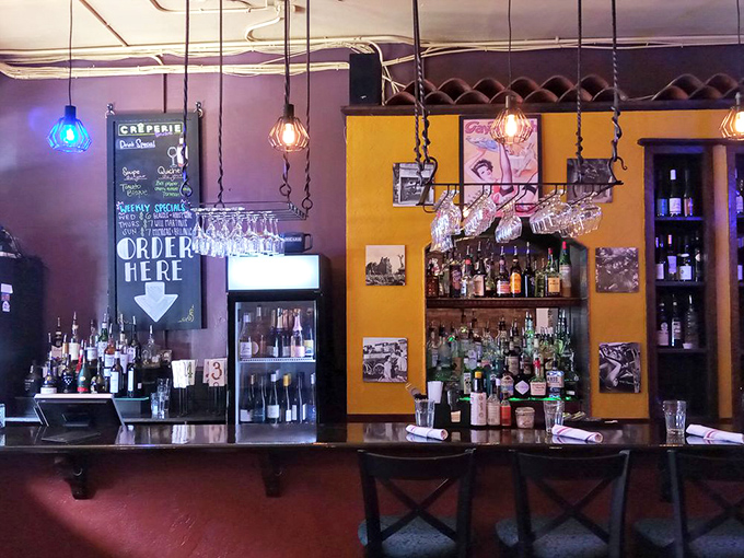 The bar area combines French charm with mountain casual&mdash;where wine glasses hang ready for the next pour of liquid happiness.
