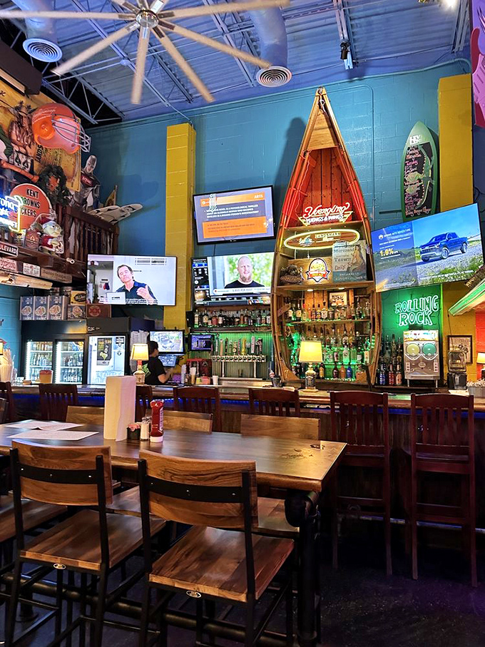 The bar area looks like a tiki lounge and a sports bar had a beautiful baby. Those canoes aren't just decoration&mdash;they're conversation starters.