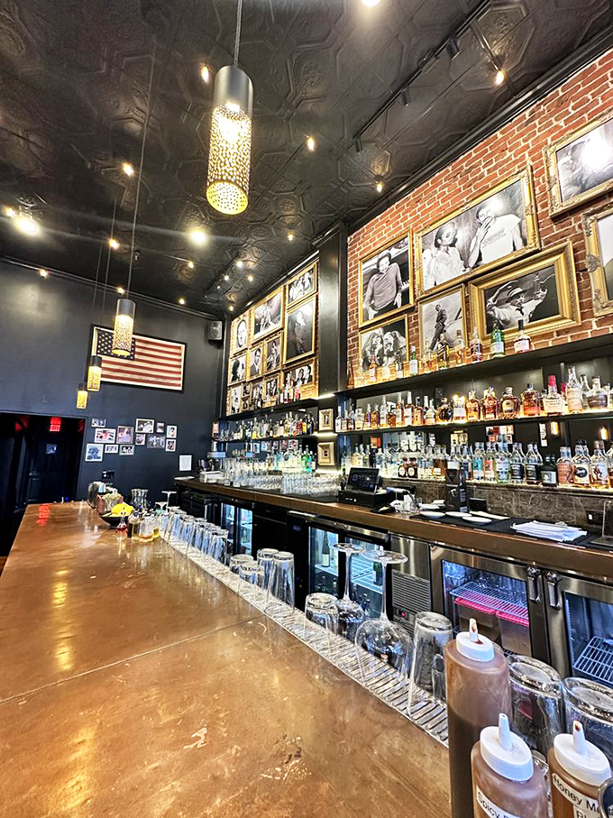 Gold-framed portraits of legends watch over bottles of bourbon &ndash; a shrine where libations and inspiration flow equally.