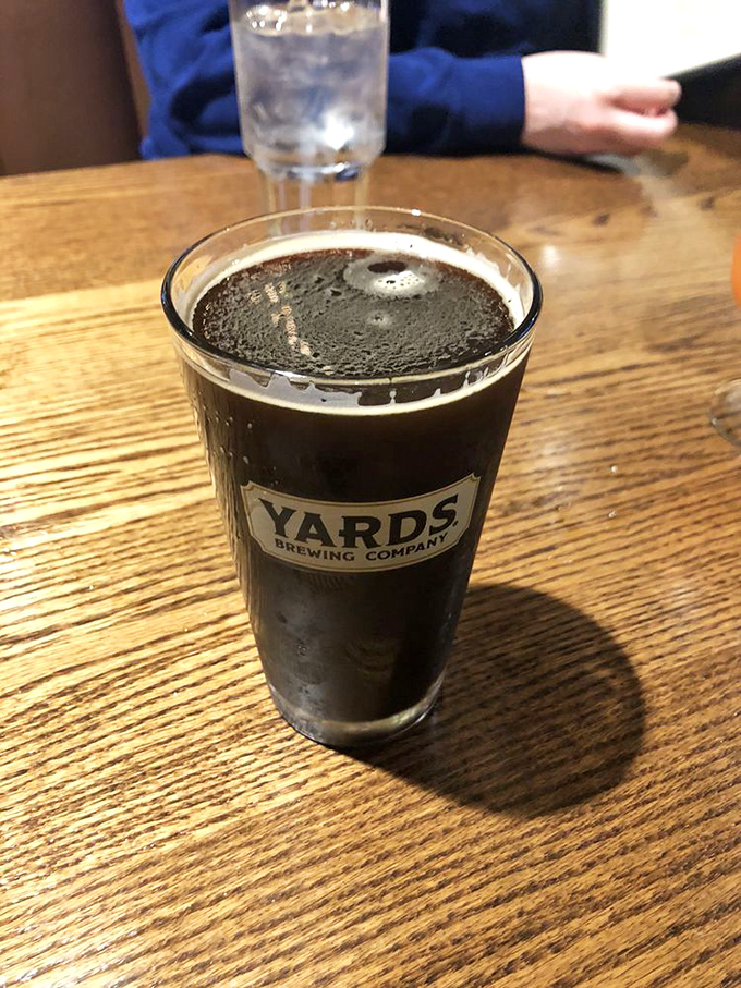 A properly poured pint of dark beer&mdash;because sometimes the best accompaniment to great food is liquid bread with a perfect foam crown.