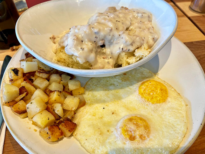 Biscuits and gravy with perfectly cooked eggs and home fries &ndash; the breakfast equivalent of winning the lottery. This plate has "nap by noon" written all over it.