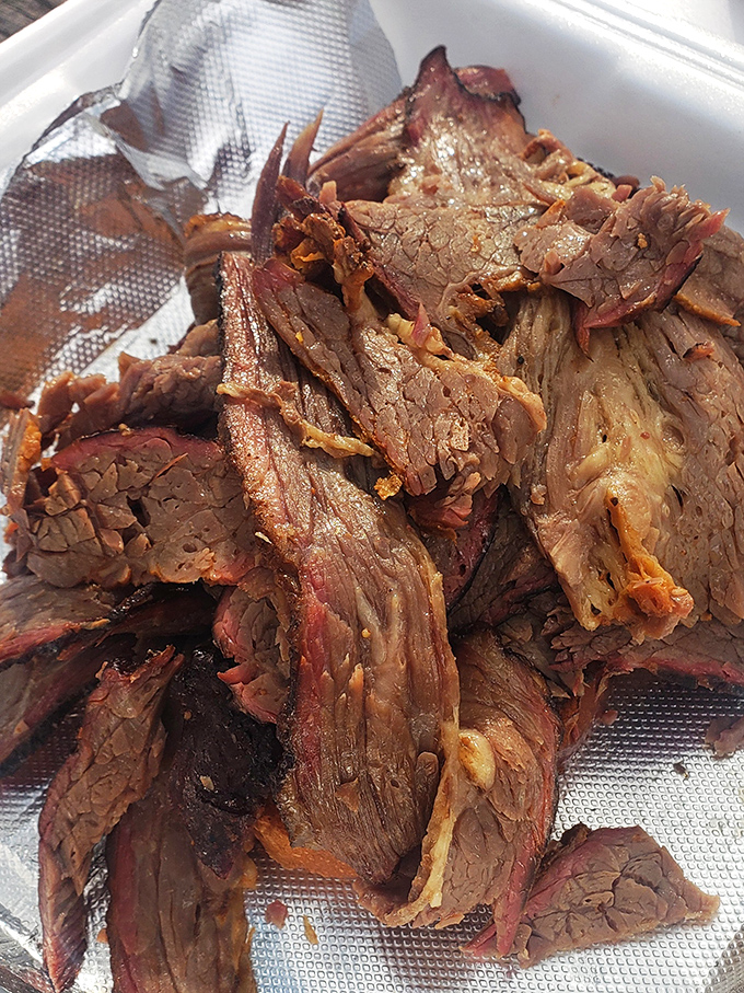 Brisket sliced so perfectly you can almost count the smoke rings. This isn't just meat&mdash;it's a time capsule of patience and expertise.