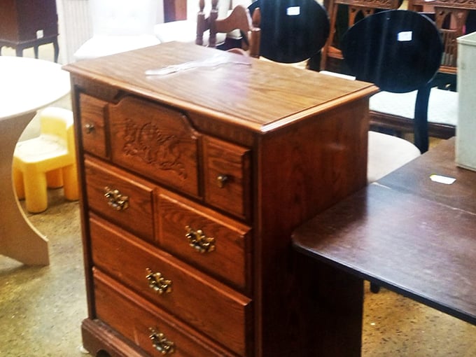 This ornate wooden dresser whispers tales of quality craftsmanship from an era before "assembly required" became the norm in furniture manufacturing.