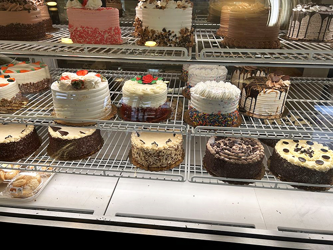 The cake display at Bing's—a tiered wonderland where birthdays, weddings, and Tuesday afternoons all find their perfect sweet companion.