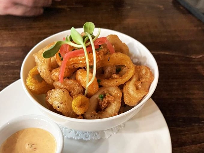 Calamari that defies the rubbery reputation of lesser versions. Crispy, tender, and served with a dipping sauce that makes you question all other condiments.