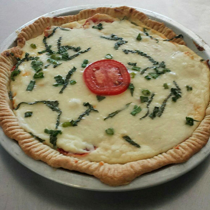 Someone placed that single tomato slice like the cherry on top of a savory sundae. This savory pie is comfort food elevated to an art form.