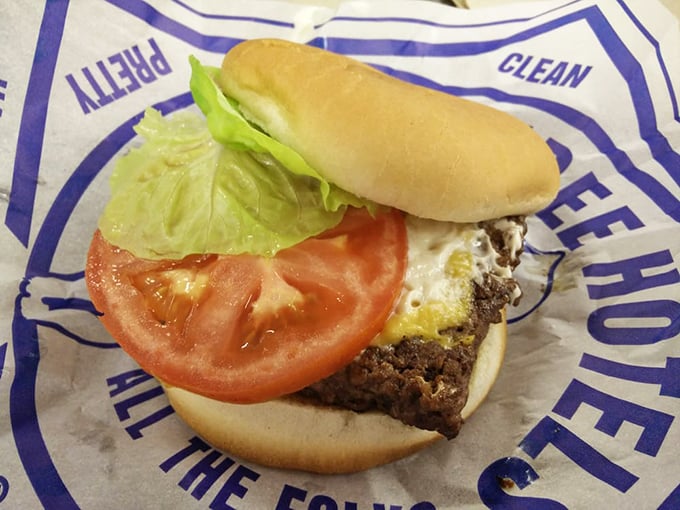 A perfect cross-section reveals the architectural genius&mdash;beef, cheese, fresh vegetables, and just enough special sauce to make you close your eyes in appreciation.