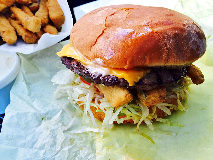 This isn't just a burger&mdash;it's architecture, engineering, and art all stacked between two buns. The onion rings? That's just showing off.