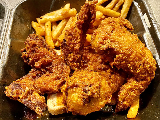 This isn't just fried chicken—it's edible artwork with a side of golden fries. The kind of meal that makes you close your eyes and sigh.