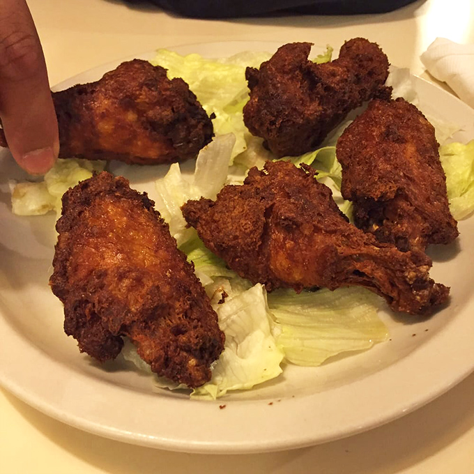Fried chicken with a crust so audibly crunchy it practically comes with its own soundtrack&mdash;golden-brown perfection on a bed of crisp lettuce.