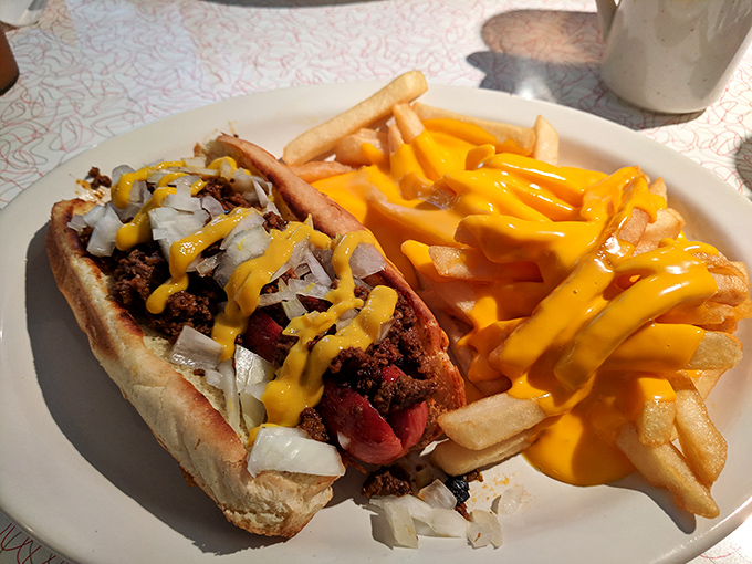 A proper chili dog doesn't apologize for being messy &ndash; it celebrates with a cascade of cheese that makes your arteries nervous and your taste buds applaud.