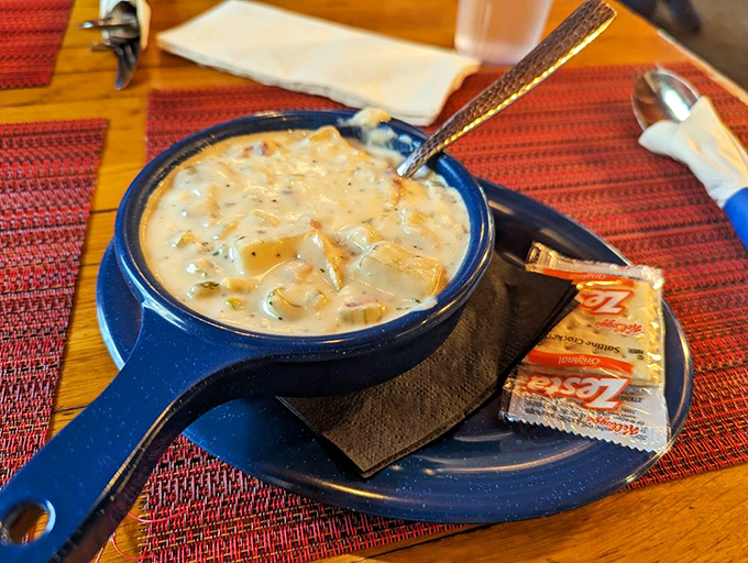 Clam chowder served in a blue ceramic bowl&mdash;creamy, hearty, and thick enough to make New Englanders nod in respectful approval. 