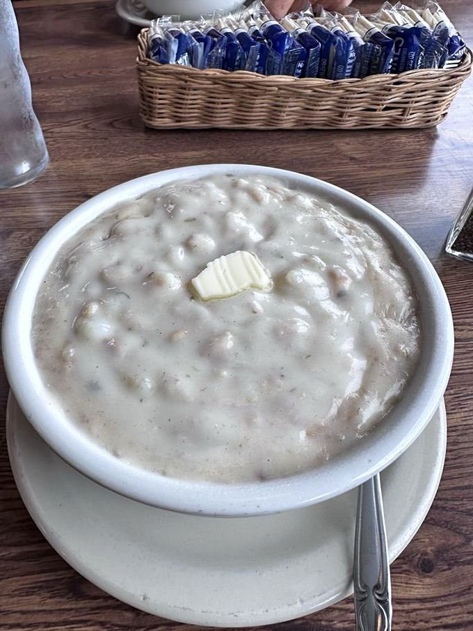 A bowl of clam chowder with a melting pat of butter&mdash;the Pacific Northwest in a bowl, warming souls one spoonful at a time.