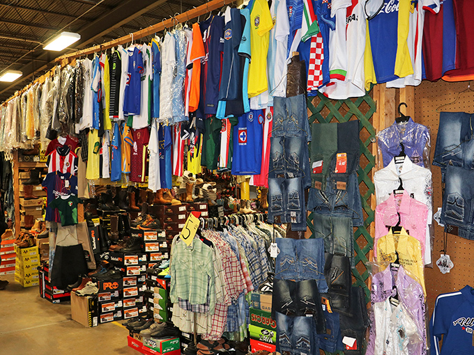 International soccer jerseys hang alongside everyday wear, turning a clothing booth into a colorful atlas of global fandom.