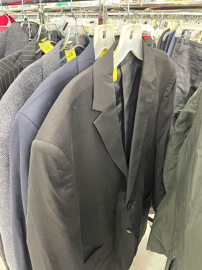 Men's suits and sport coats hang with quiet dignity. That herringbone blazer could be your next job interview MVP.