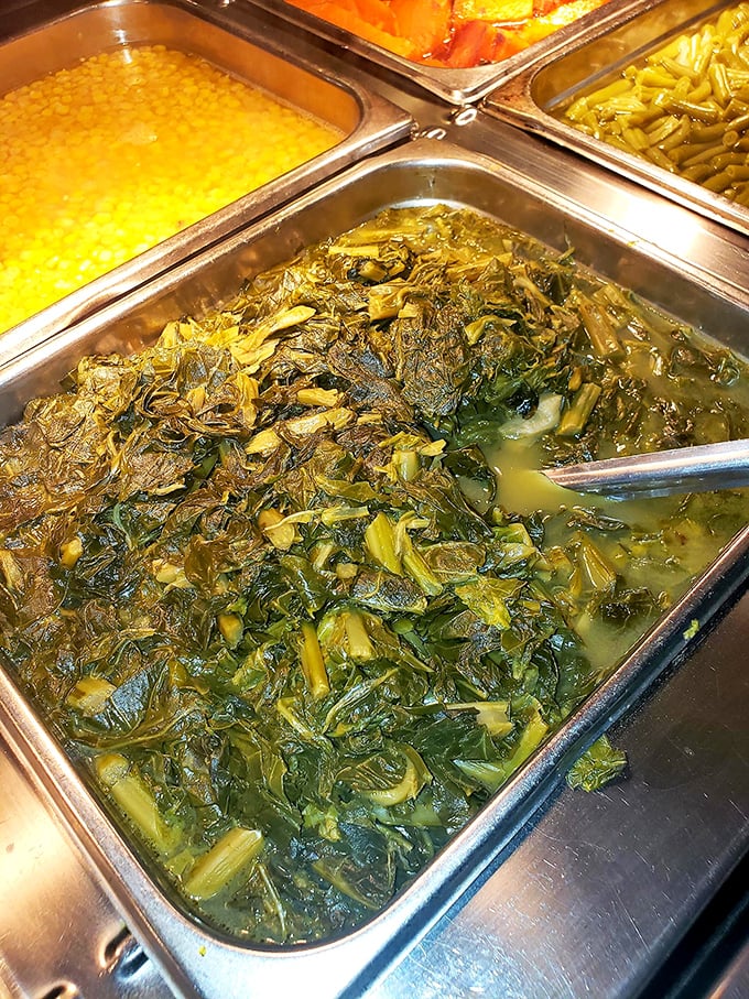 Those collard greens have been simmering since breakfast, absorbing enough flavor to make even vegetable skeptics reconsider their life choices.