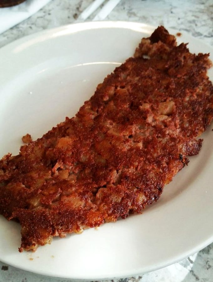 A close-up that reveals the caramelized perfection of their corned beef hash. If crispy edges could speak, they'd be bragging in multiple languages.