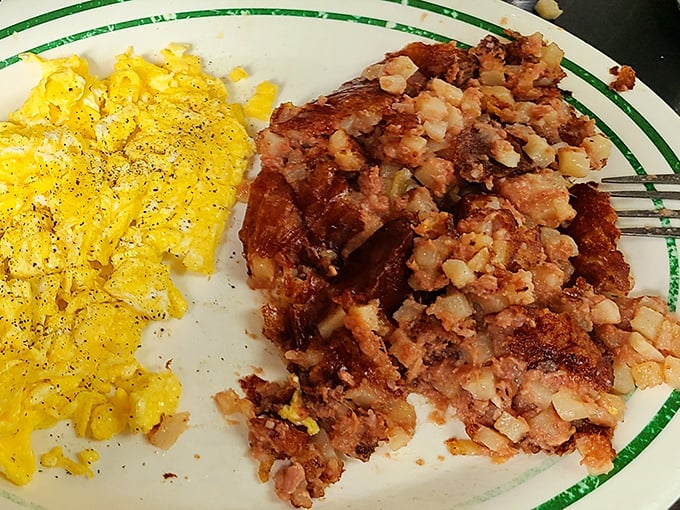 Scrambled eggs and corned beef hash&mdash;a breakfast power couple that belongs in the Comfort Food Hall of Fame. Simple perfection on a plate with that signature green-rimmed diner china.
