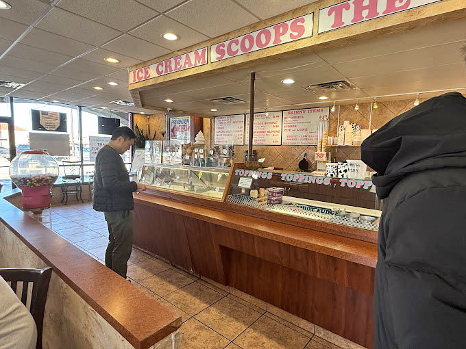 A customer contemplates life's most important decision: which of Henry's handcrafted flavors will change their day for the better. 