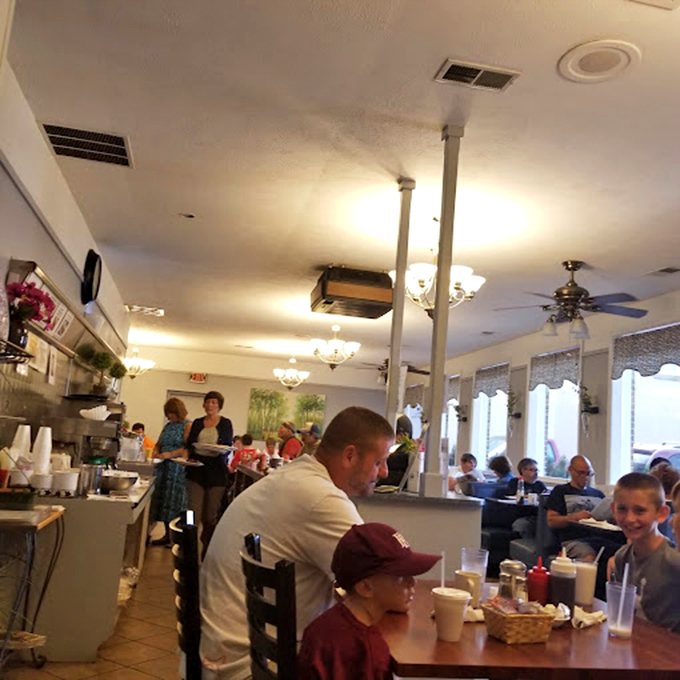 The true measure of a breakfast spot: families gathering, conversations flowing, and not a cell phone in sight &ndash; just people connected by pancakes.