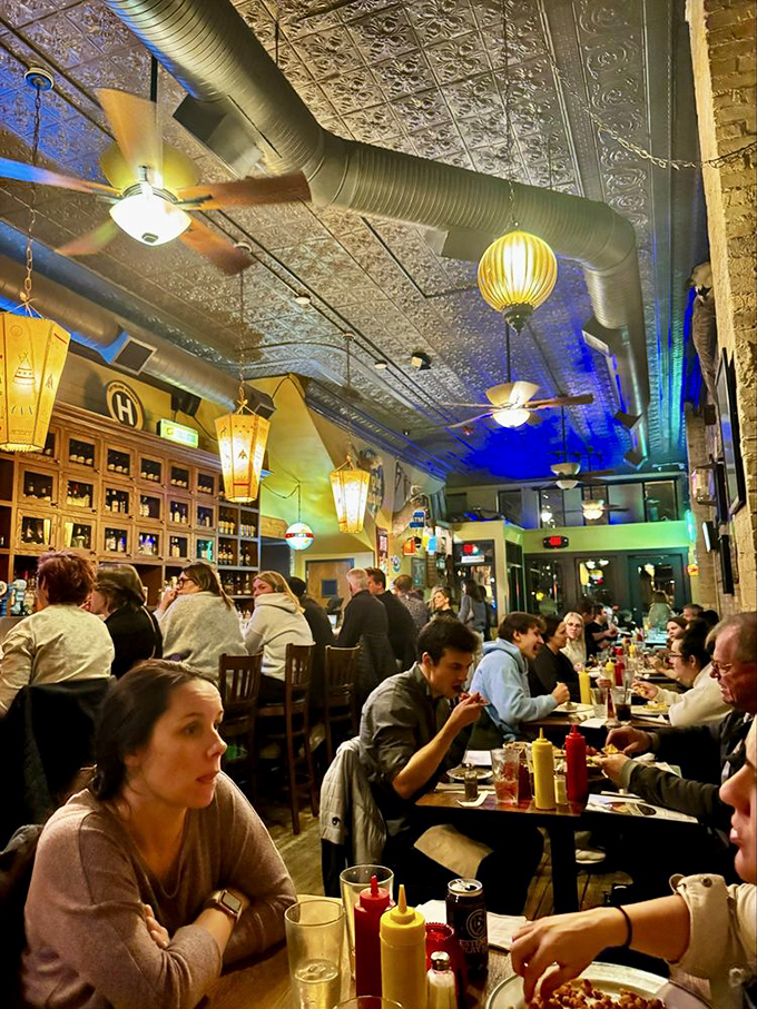 The dining room hums with the universal language of good food and better company. 