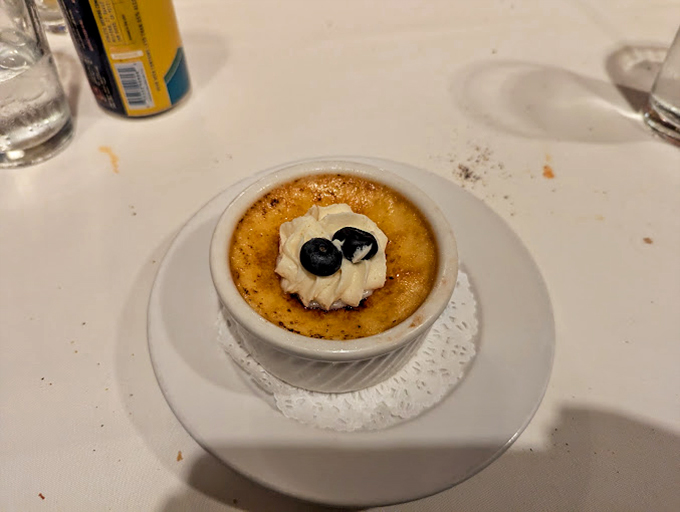 This cr&egrave;me br&ucirc;l&eacute;e topped with fresh berries isn't just dessert&mdash;it's the sweet finale to a symphony of flavors.