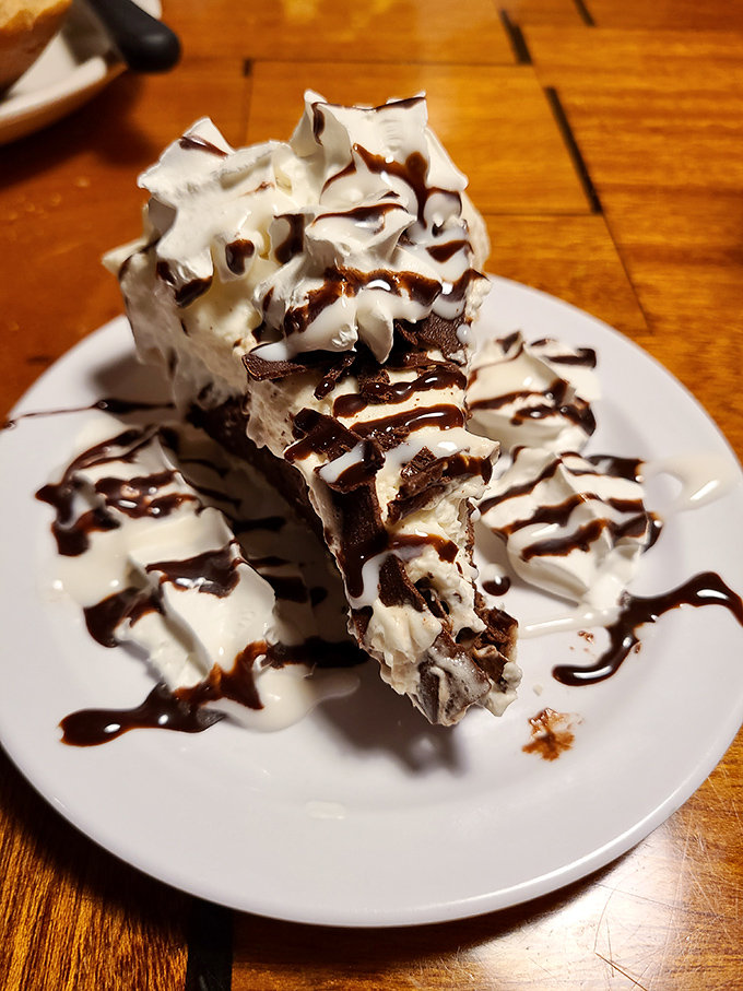 This isn't just dessert &ndash; it's architecture. Layers of chocolate, cream, and drizzle create a sweet skyscraper worth every calorie.