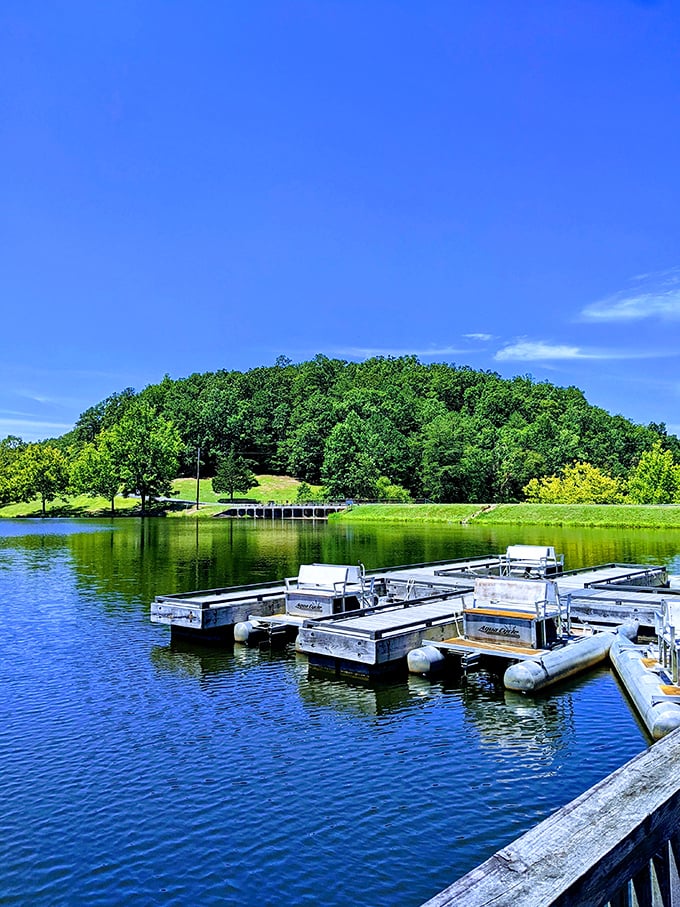 Floating docks await water enthusiasts while hills stand guard in the background &ndash; nature and recreation in perfect harmony.