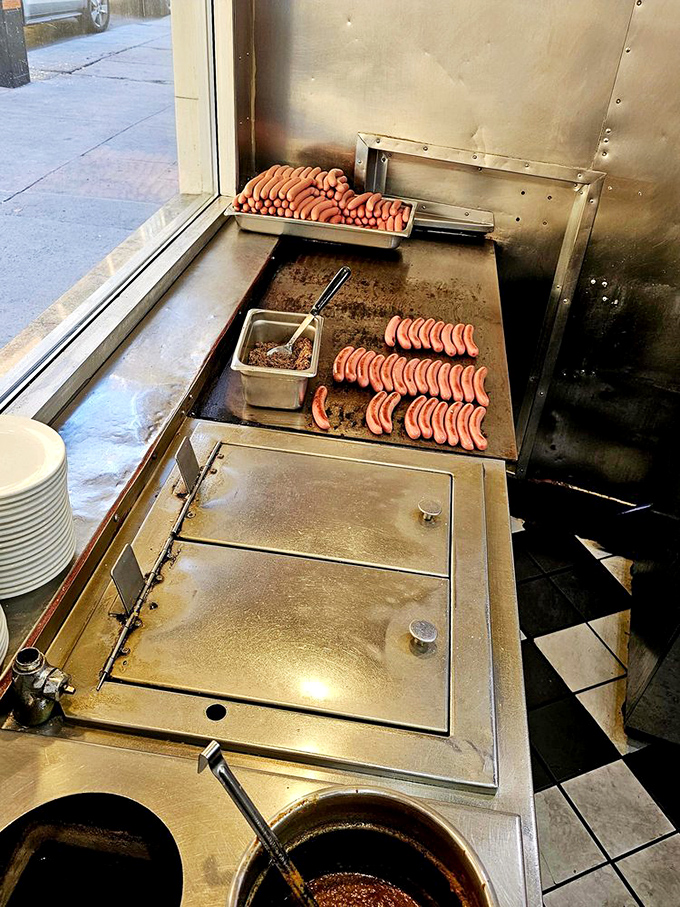 Hot dogs lined up like soldiers awaiting their delicious destiny. This grill has probably seen more history than most Detroit museums.