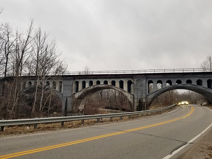 Overcast skies provide the classic backdrop for ghost hunting. The bridge's silhouette against gray clouds could be the cover of a mystery novel.