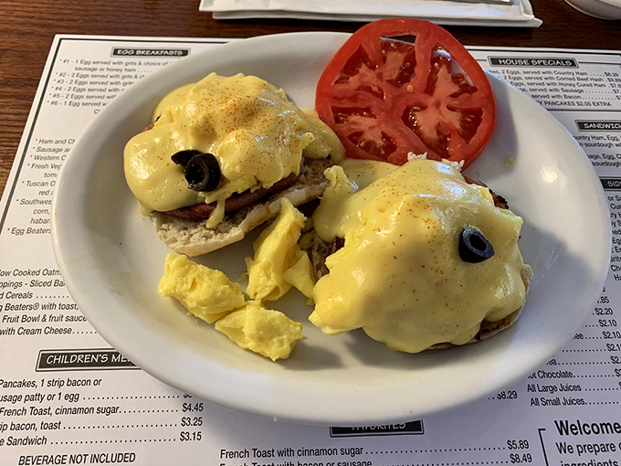 Eggs Benedict – the breakfast equivalent of formal wear. Hollandaise sauce draped over poached eggs like a silky yellow tuxedo jacket.