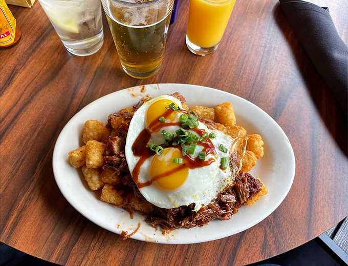 This isn't just breakfast&mdash;it's performance art with a sunny-side-up finale. That pulled pork hash crowned with eggs deserves a standing ovation.