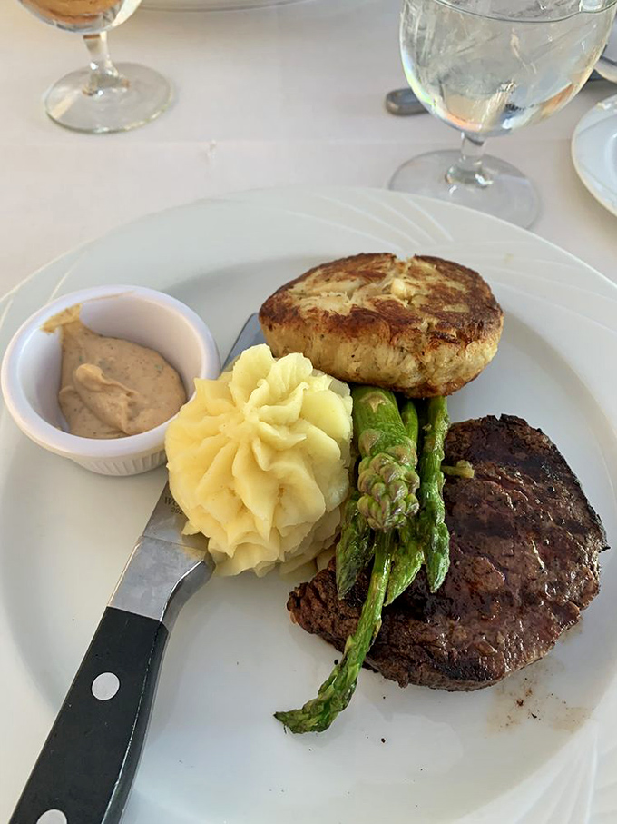Surf meets turf in perfect harmony – a ballet of filet mignon, crab cake, and asparagus that deserves a standing ovation.