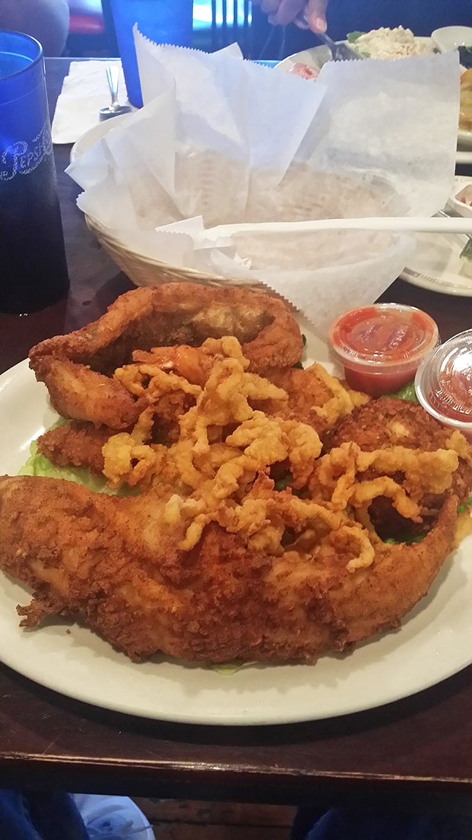 Seafood fried to the exact point where Neptune himself would approve. The kind of dish that makes you grateful for coastal proximity.