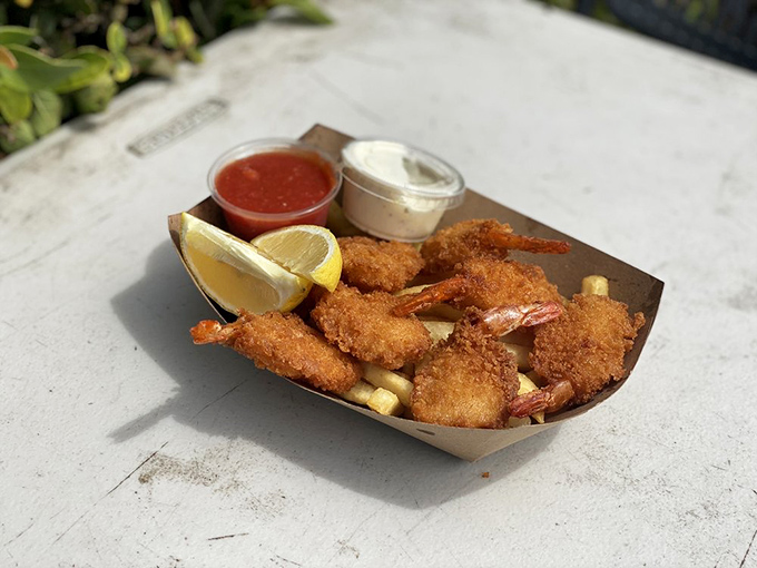 Golden-fried shrimp that crunch like autumn leaves, served with dipping sauces that make you question your lifelong condiment loyalties.